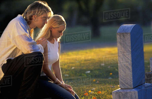 Visiting A Grave - Stock Photo - Dissolve