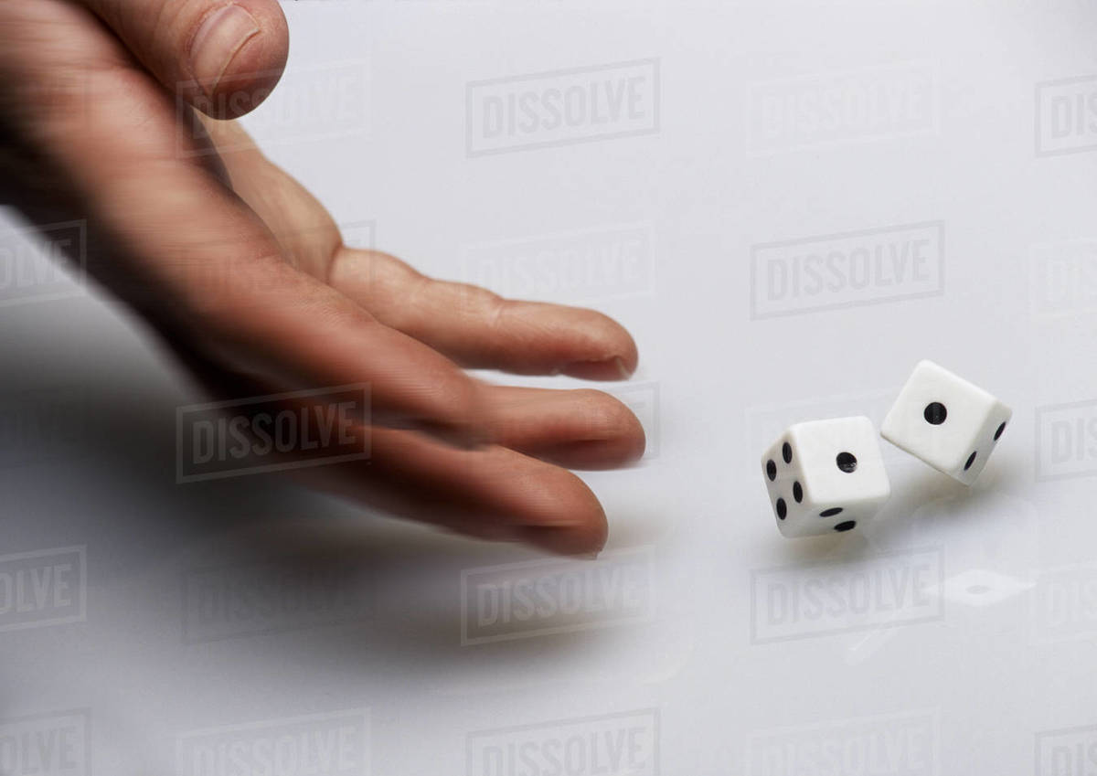 Hand Rolling Die - Stock Photo - Dissolve