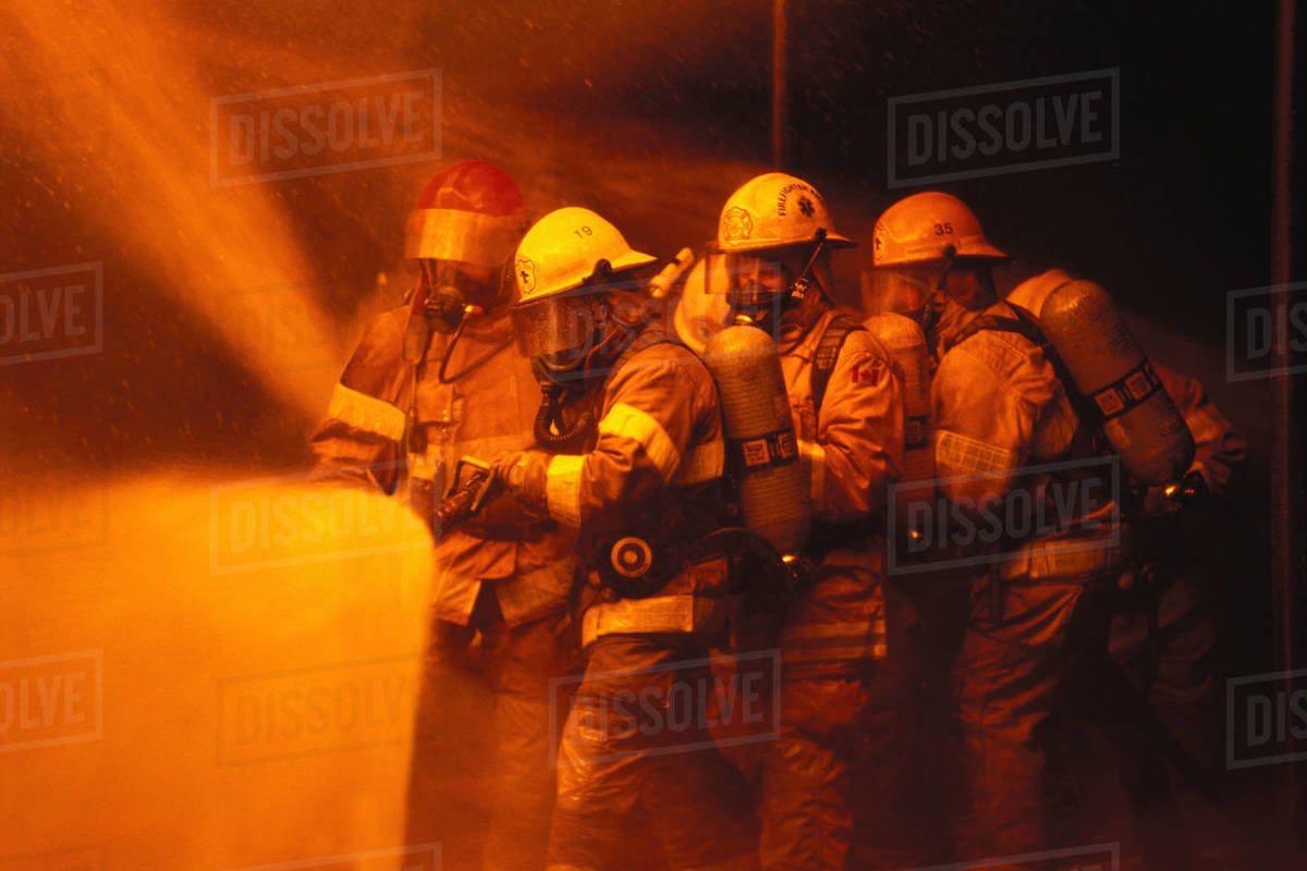 Firemen Fighting Fire - Stock Photo - Dissolve