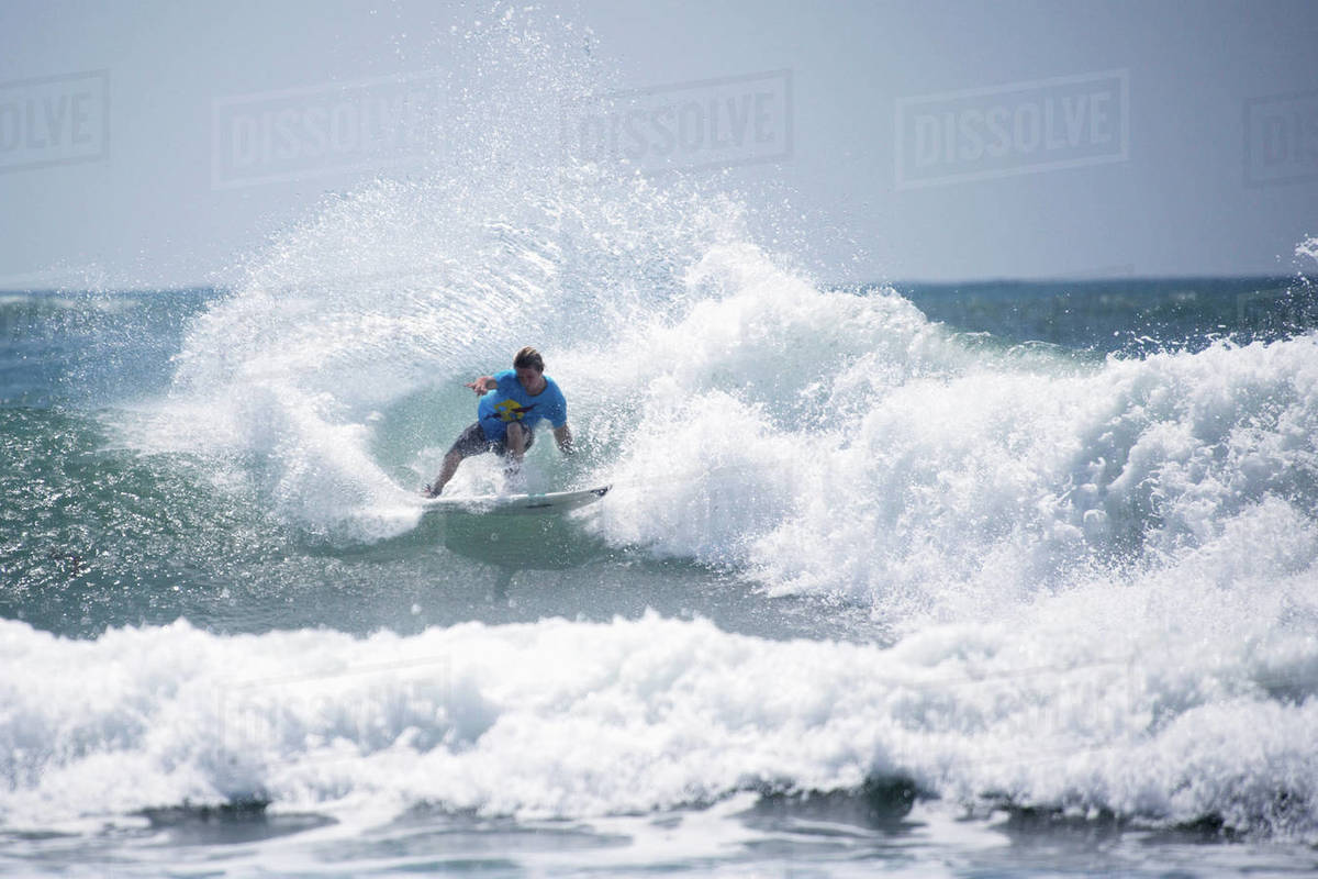 Man Surfing, Tanzania,East Africa - Stock Photo - Dissolve