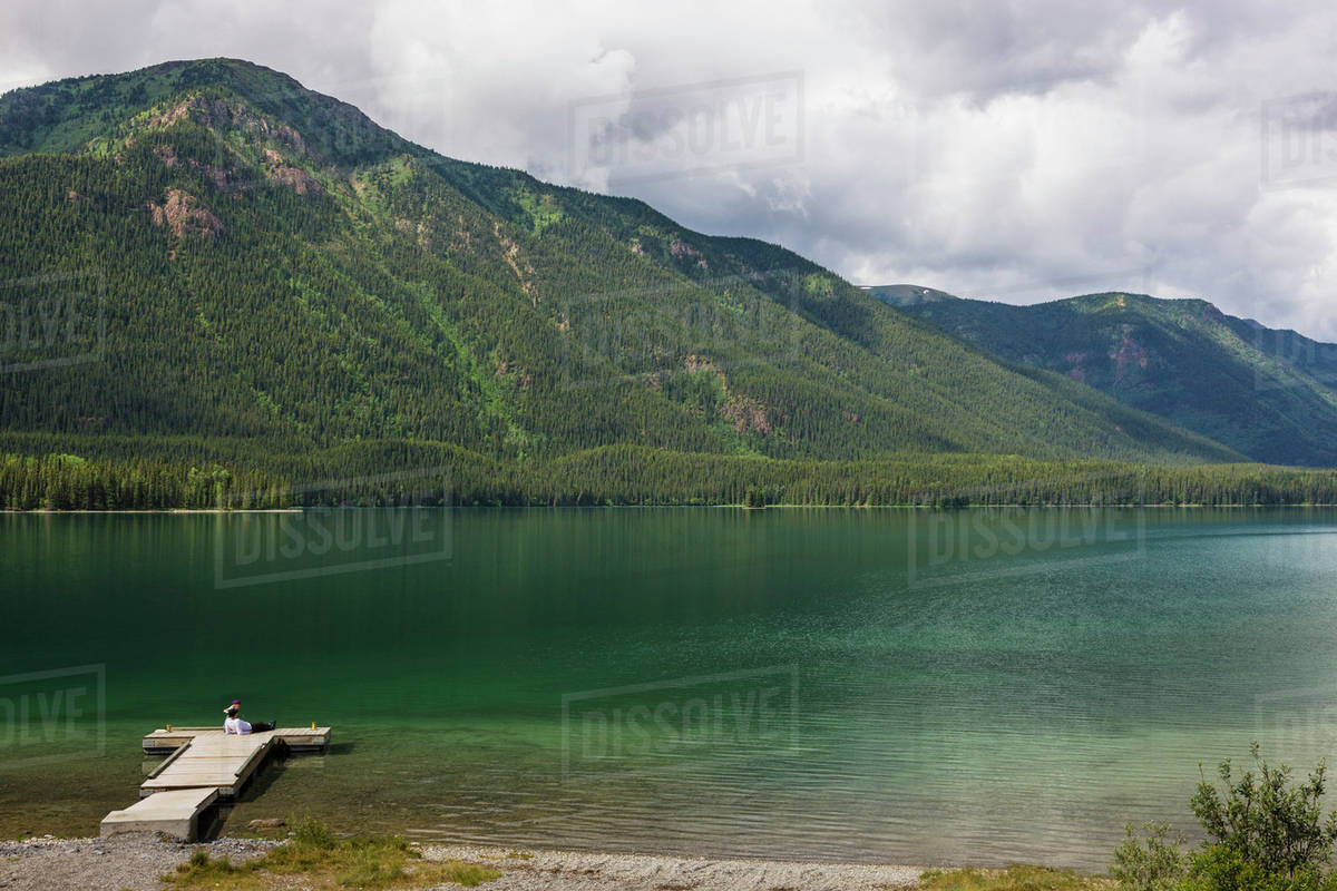 Mother and daughter on a dock at Muncho Lake Provincial Park, British ...