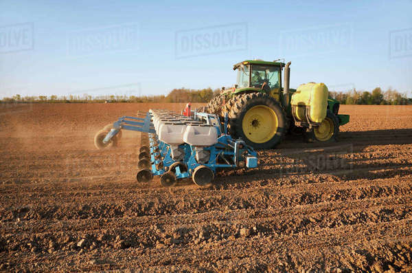 Agriculture - A John Deere tractor and Monosem 24 twin-row planter ...