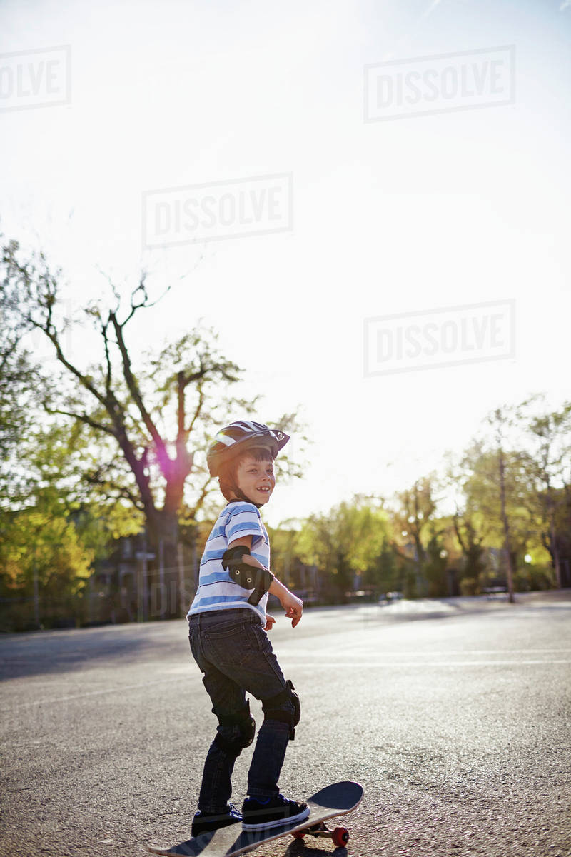 Young boy riding a skateboard; Montreal, Quebec, Canada - Royalty-free ...