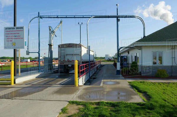 Agriculture - Ethanol production plant. Grain corn trucks being weighed ...