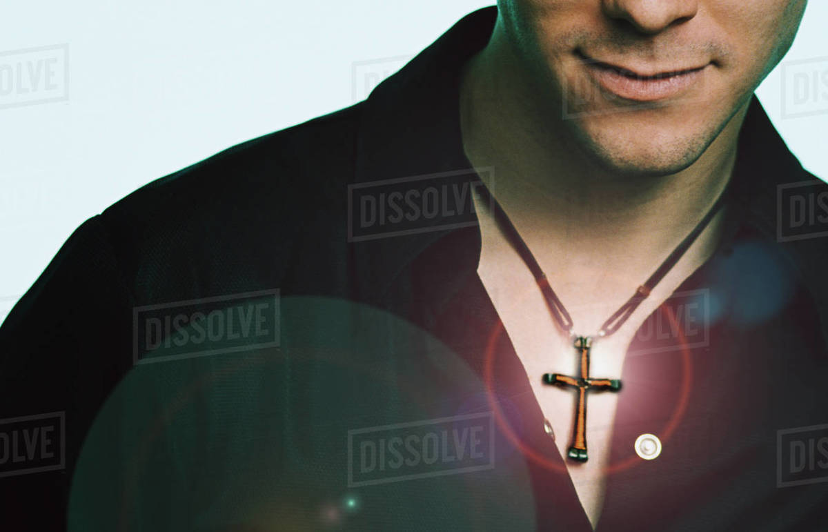 Man Wearing Cross - Stock Photo - Dissolve