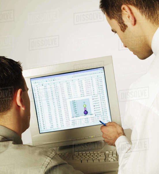 Two Men Working On Computer - Royalty-free Stock Photo | Dissolve