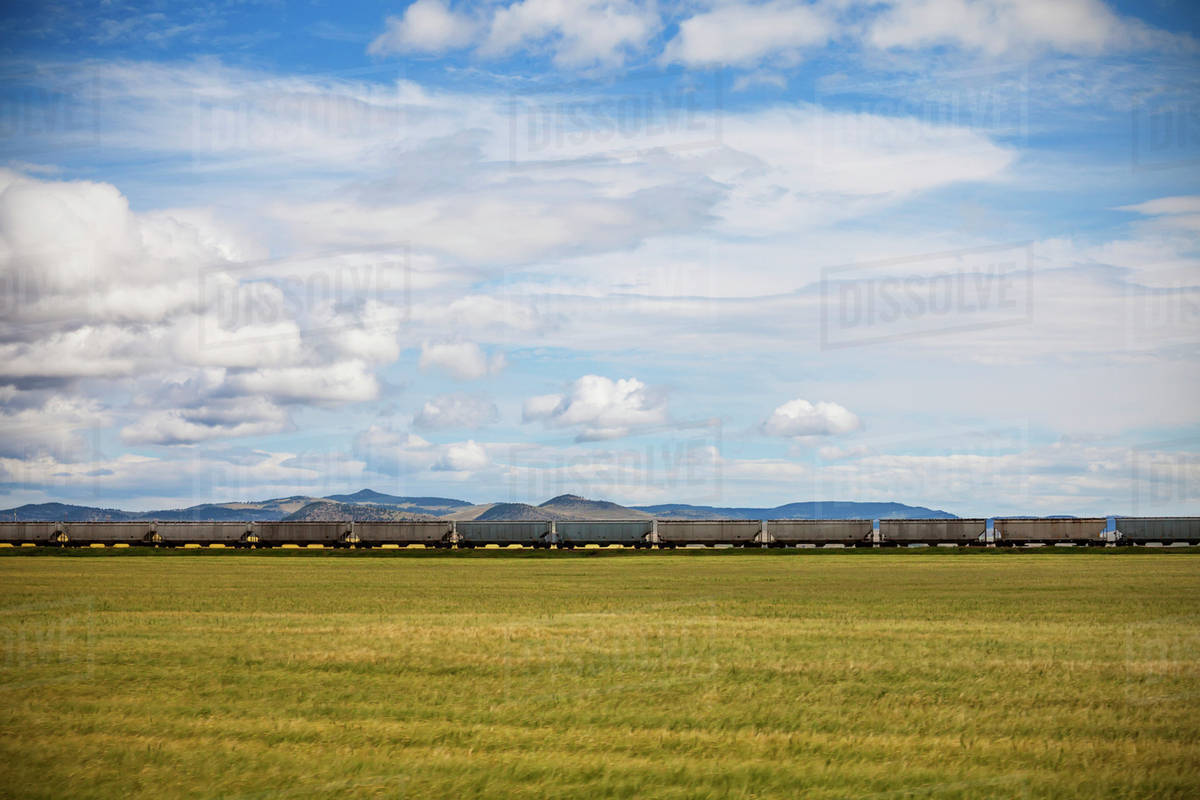 Train hauling goods across the plains in Southern Alberta; Alberta ...