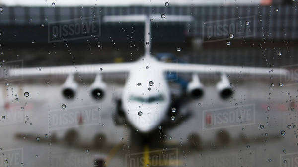 View of the front of an aircraft through a wet window; Munich, Germany ...