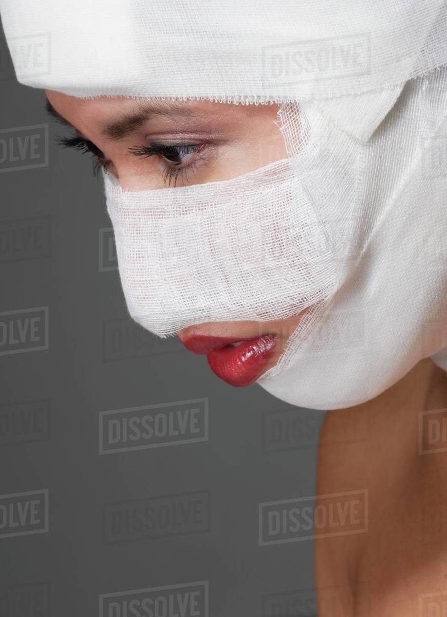 Woman With Bandages On Her Face - Royalty-free Stock Photo | Dissolve