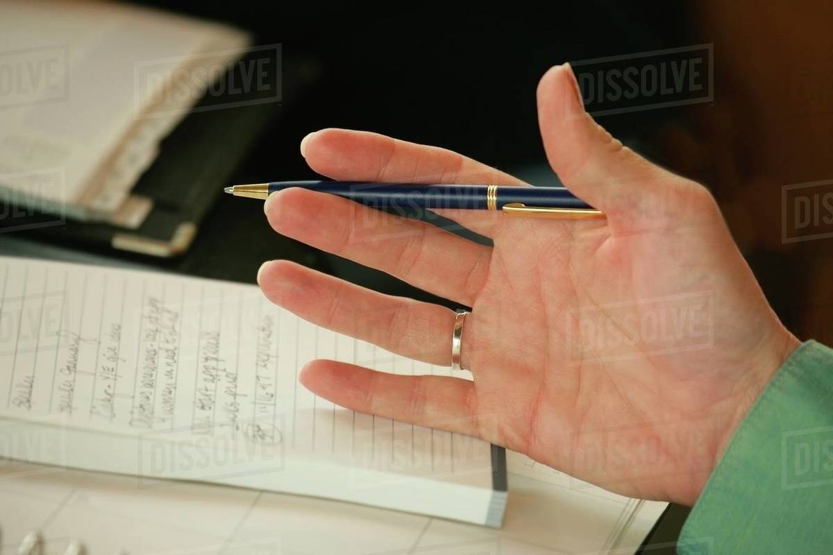 Hand Holding A Pen - Royalty-free Stock Photo | Dissolve