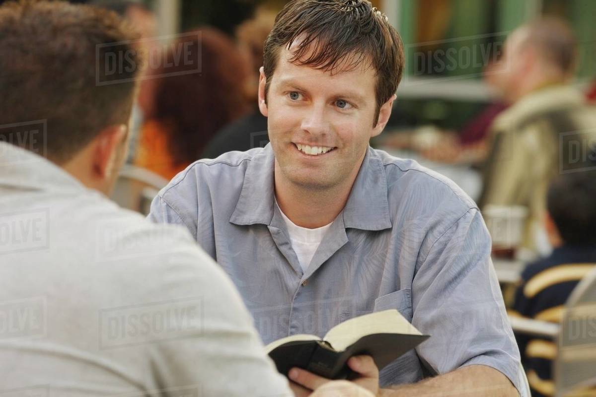 Man Sharing From A Book - Royalty-free Stock Photo | Dissolve