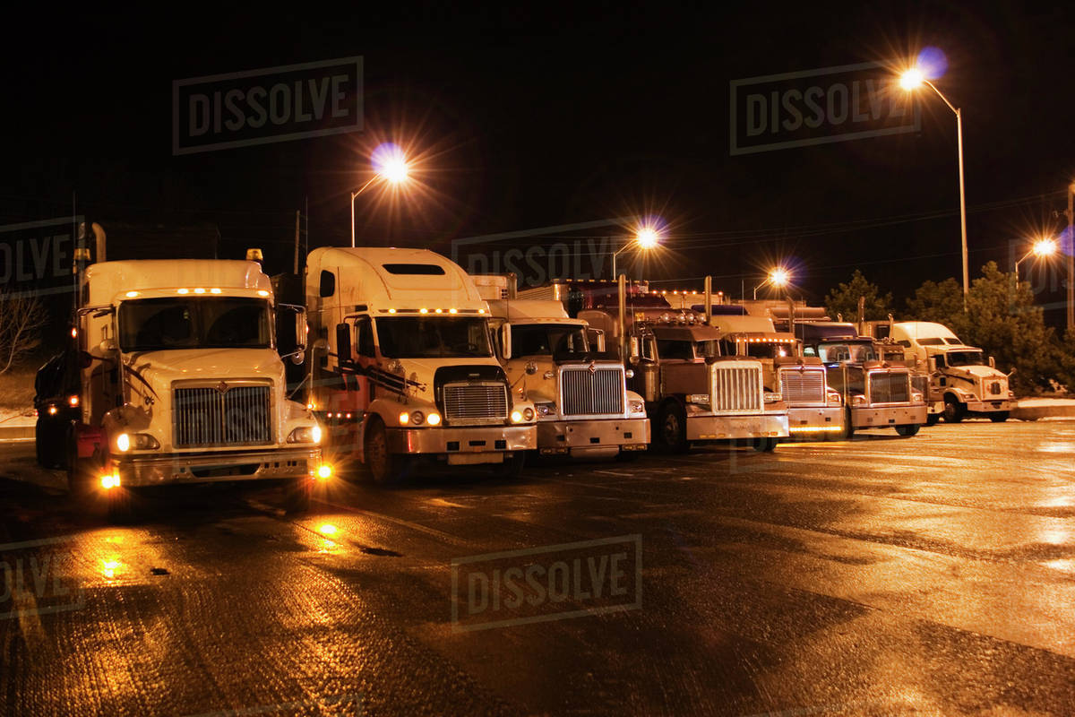 Parking Lot For Transport Trucks At Night; Canada, Ontario - Royalty ...