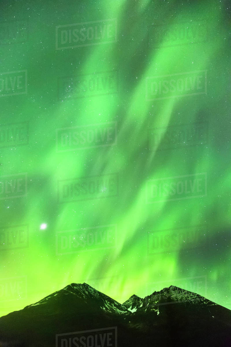 Northern Lights in the sky above Moose Pass, with silhouetted Kenai ...