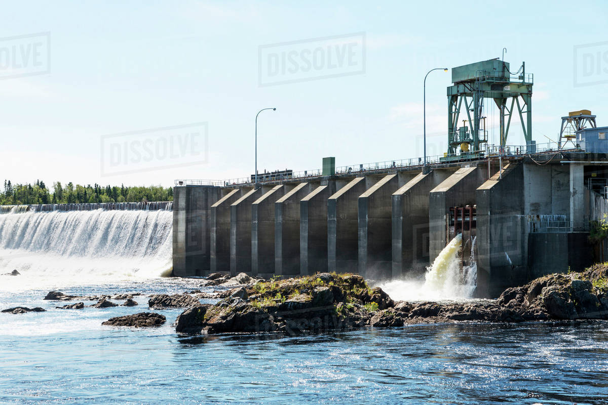 A waterfall and dam on Exploits River; Bishop's Falls, Newfoundland and Labrador, Canada ...