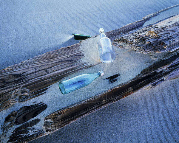 Glass bottles wash ashore at Umpqua Beach; Winchester Bay, Oregon ...