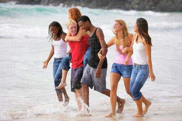 Group Of Teenagers At The Beach - Royalty-free Stock Photo | Dissolve