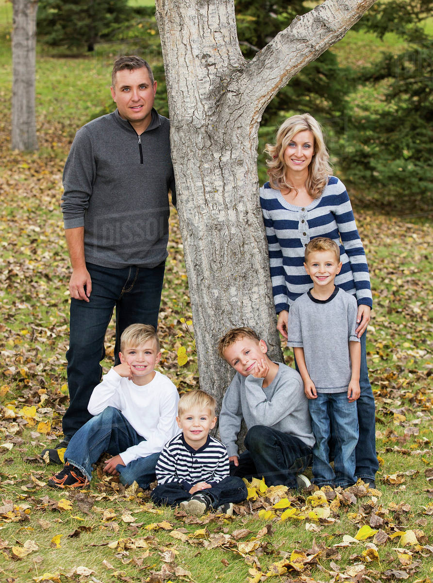 Portrait of a family with four sons in a park in autumn; Edmonton ...