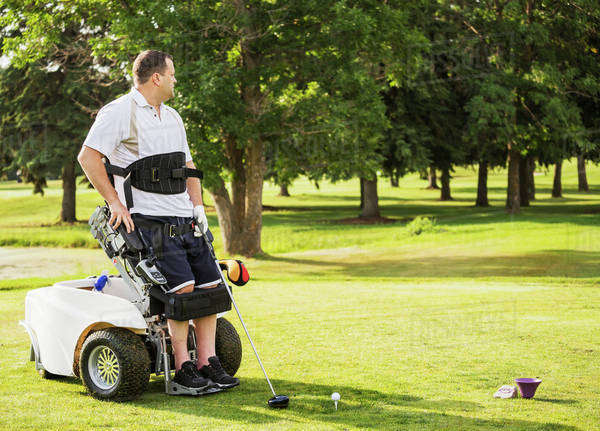 Disabled golfer in a tournament using high tech mobility aid; Edmonton ...