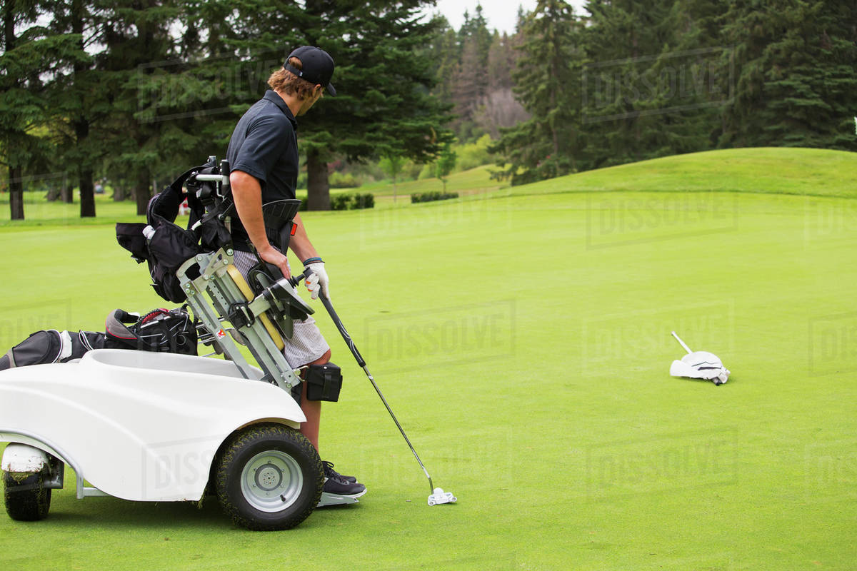Disabled golfer in a tournament using high tech mobility aid; Edmonton ...