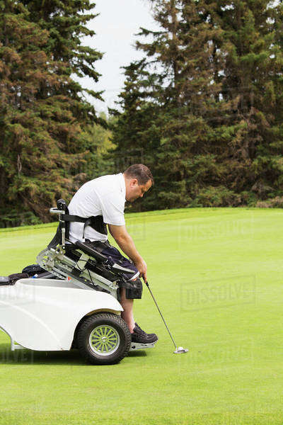 Disabled golfer in a tournament using high tech mobility aid; Edmonton ...