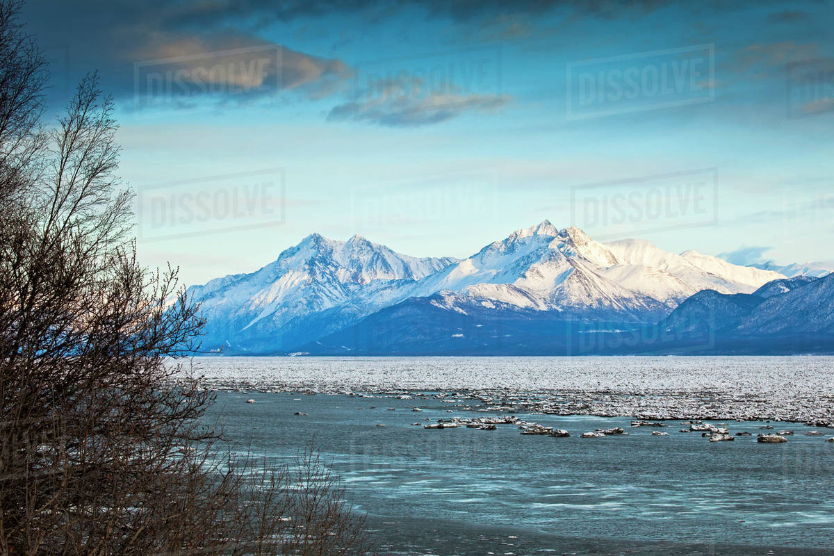 Snow covered Chugach Mountains over Knik Arm with ice flows on the ...