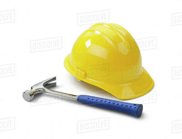 A hammer and yellow hard hat - Royalty-free Stock Photo | Dissolve