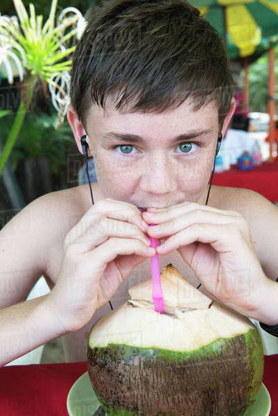 Boy drinking coconut milk from a shell;Thailand - Royalty-free Stock ...