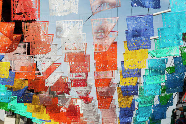 Colourful mexican fiesta flags decorate a street;Puerto vallarta mexico ...