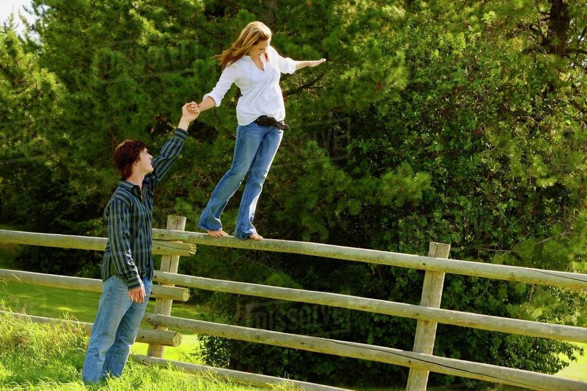Balancing On Fence Rail - Royalty-free Stock Photo | Dissolve
