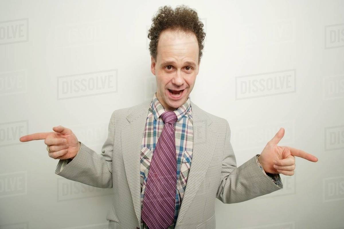 Adult Pointing In Opposite Directions - Royalty-free Stock Photo | Dissolve