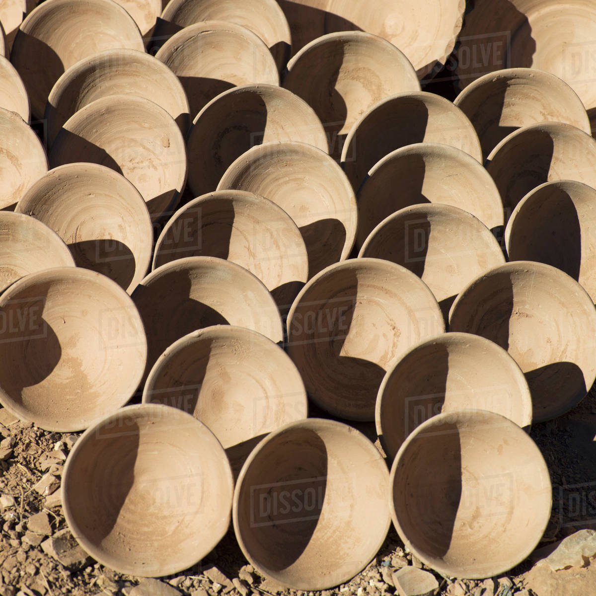 Rows of clay bowls on display on the ground - Royalty-free Stock Photo ...