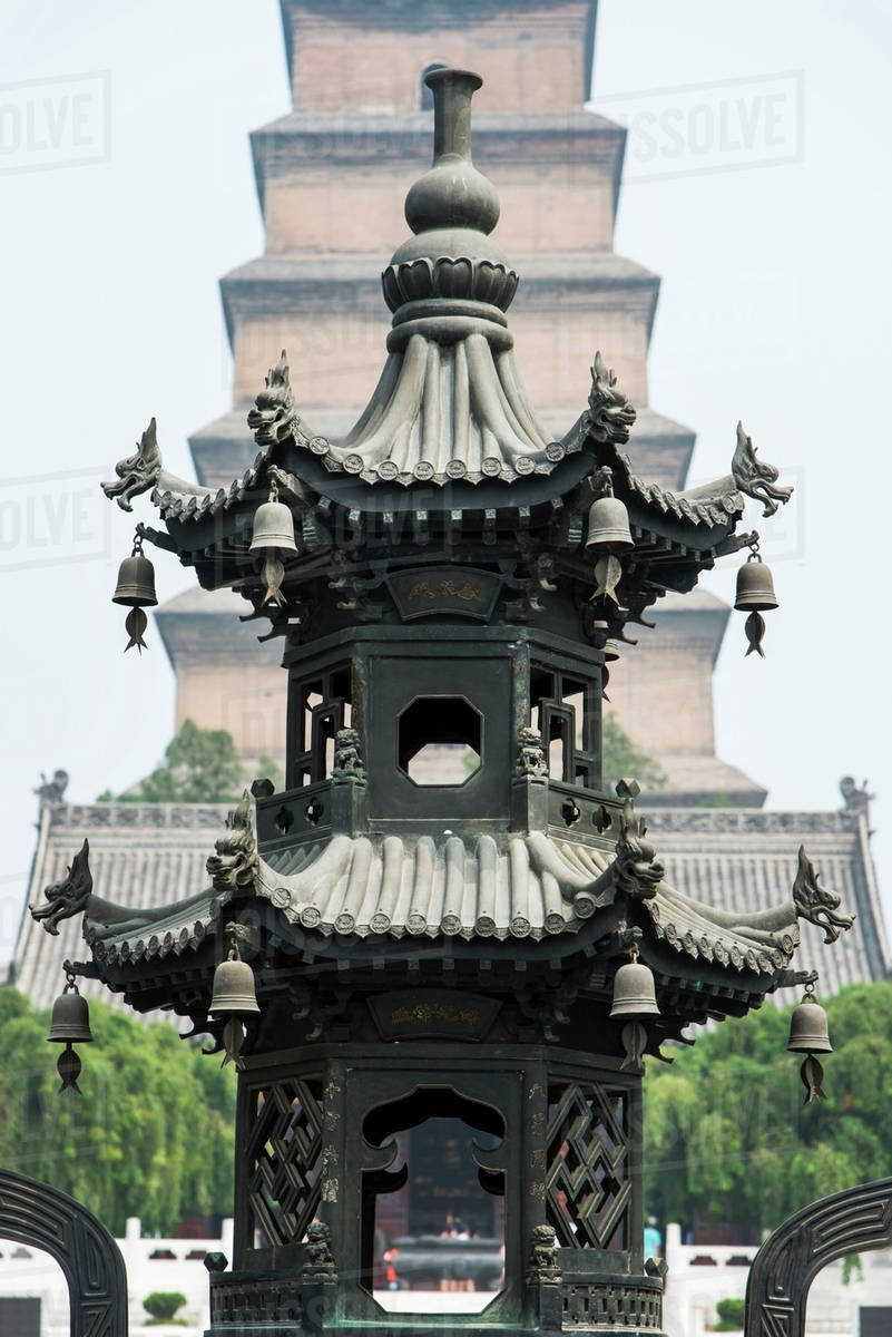 A metal structure with Chinese architecture and a tower in the ...