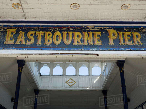 Eastbourne Pier entrance with details of the painted sign, colonnade ...