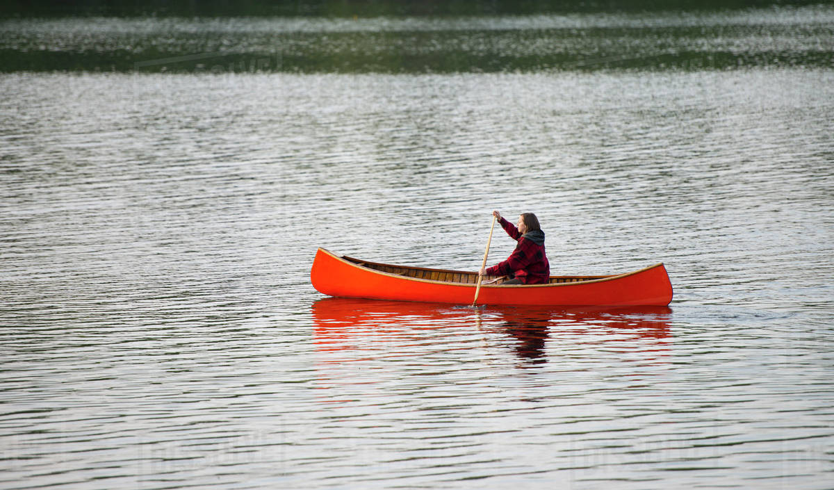 Girl In An Orange Canoe; Ontario, Canada - Royalty-free Stock Photo ...