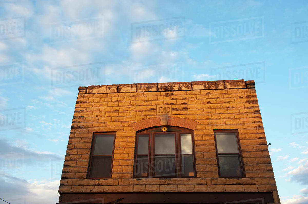 Facade and windows of an old building built from native limestone in ...
