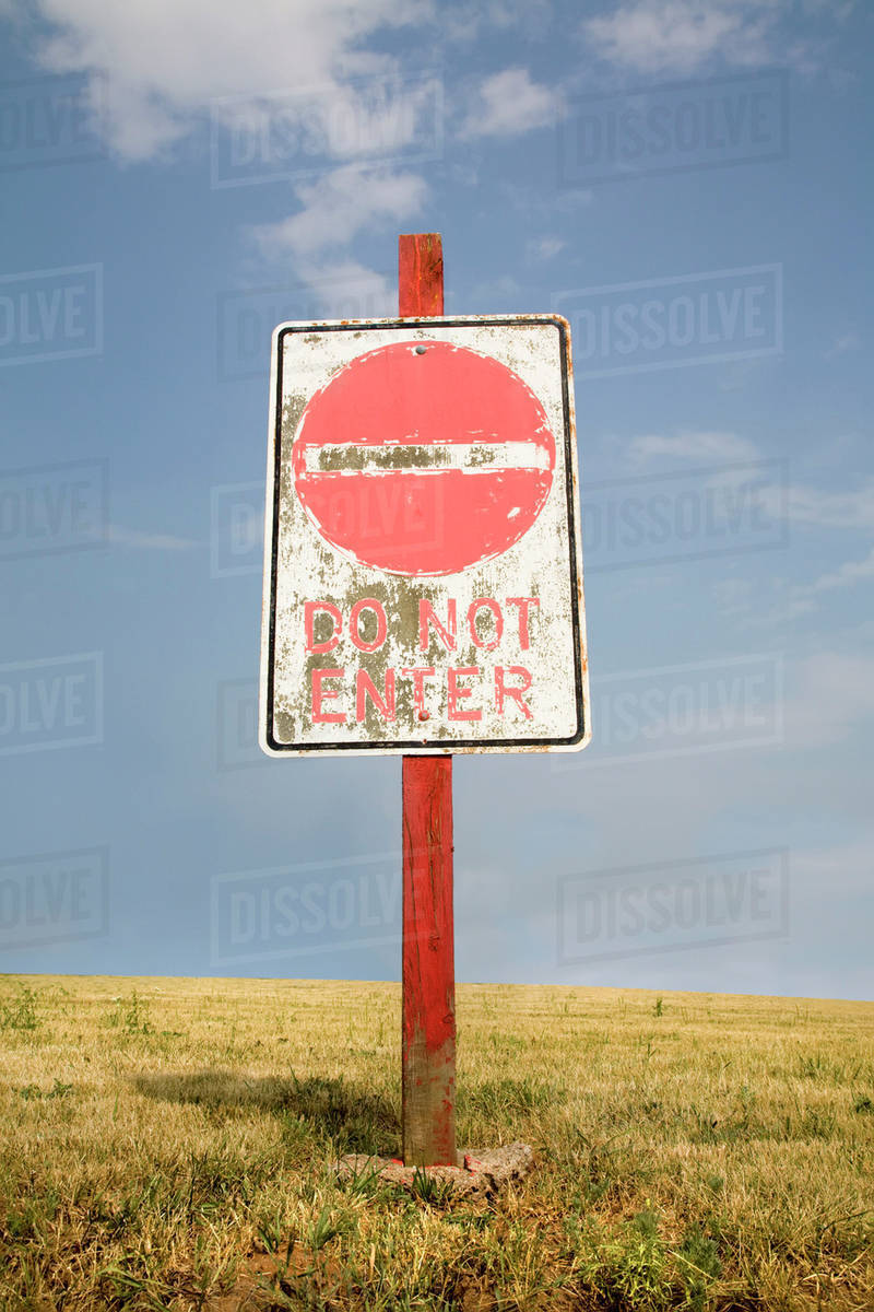 A worn and weathered do not enter sign; Oakville, Ontario, Canada ...