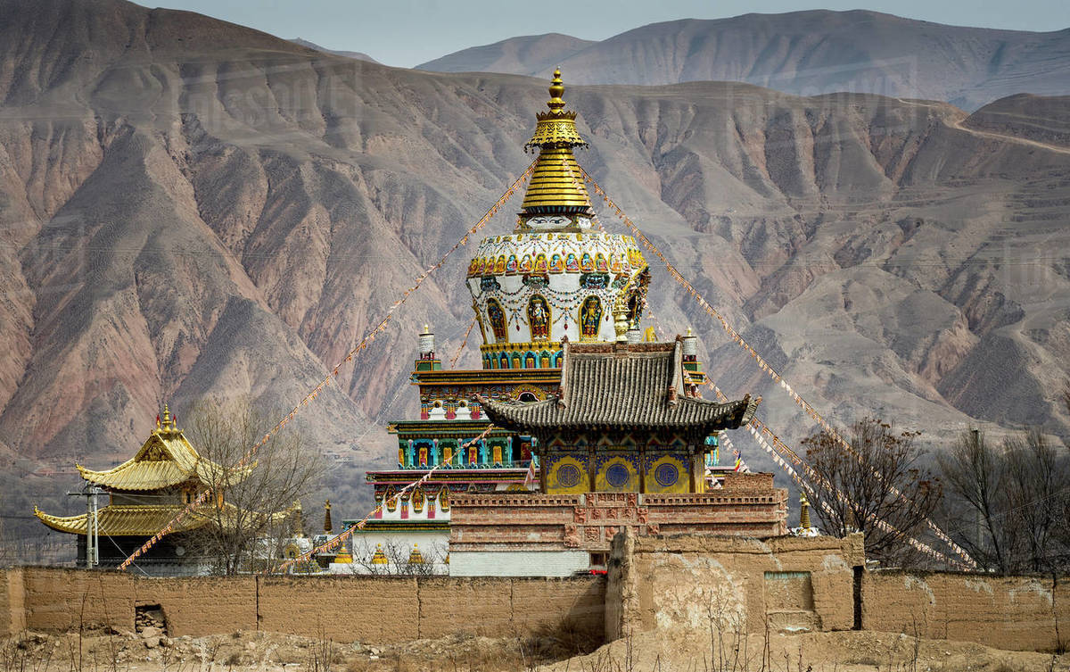 The rooftop of a Buddhist Temple at the Labrang Monastery with the ...