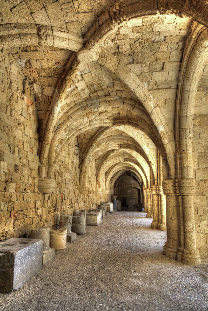 Gothic Architecture with a view through an archway a colonnade of the ...