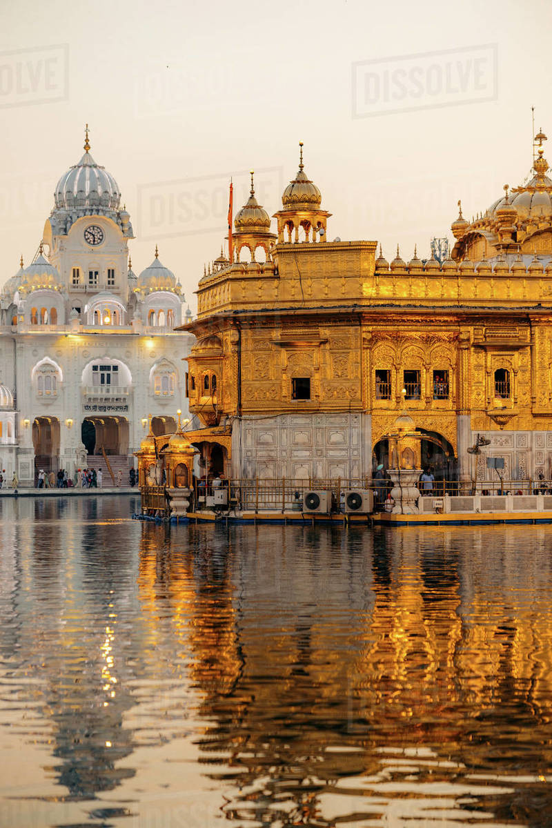 Golden Temple, a Sikh Gurdwara with the mirror image reflection in a ...