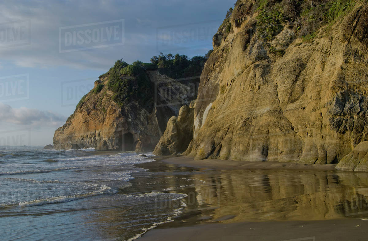 Surf breaks at Hug Point, Arch Cape; Oregon, United States of America ...