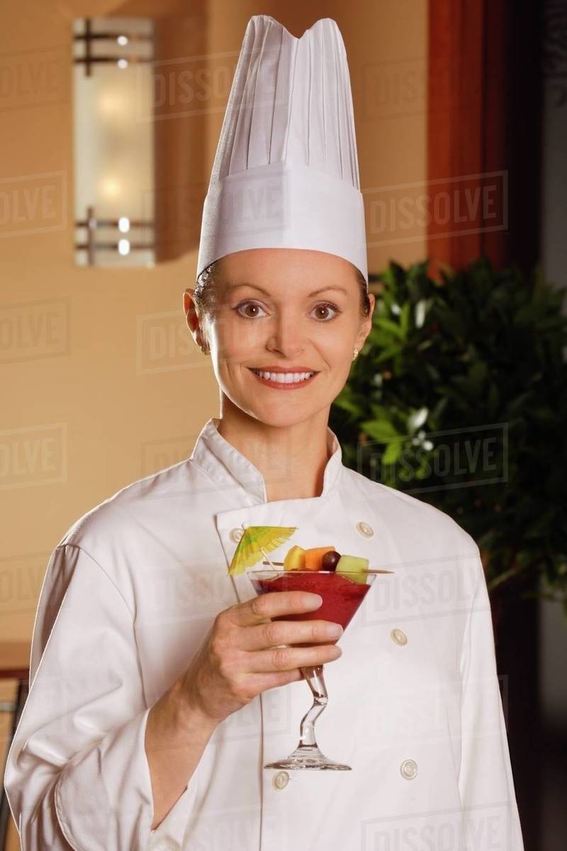 Portrait Of Chef Presenting Tropical Drink - Stock Photo - Dissolve