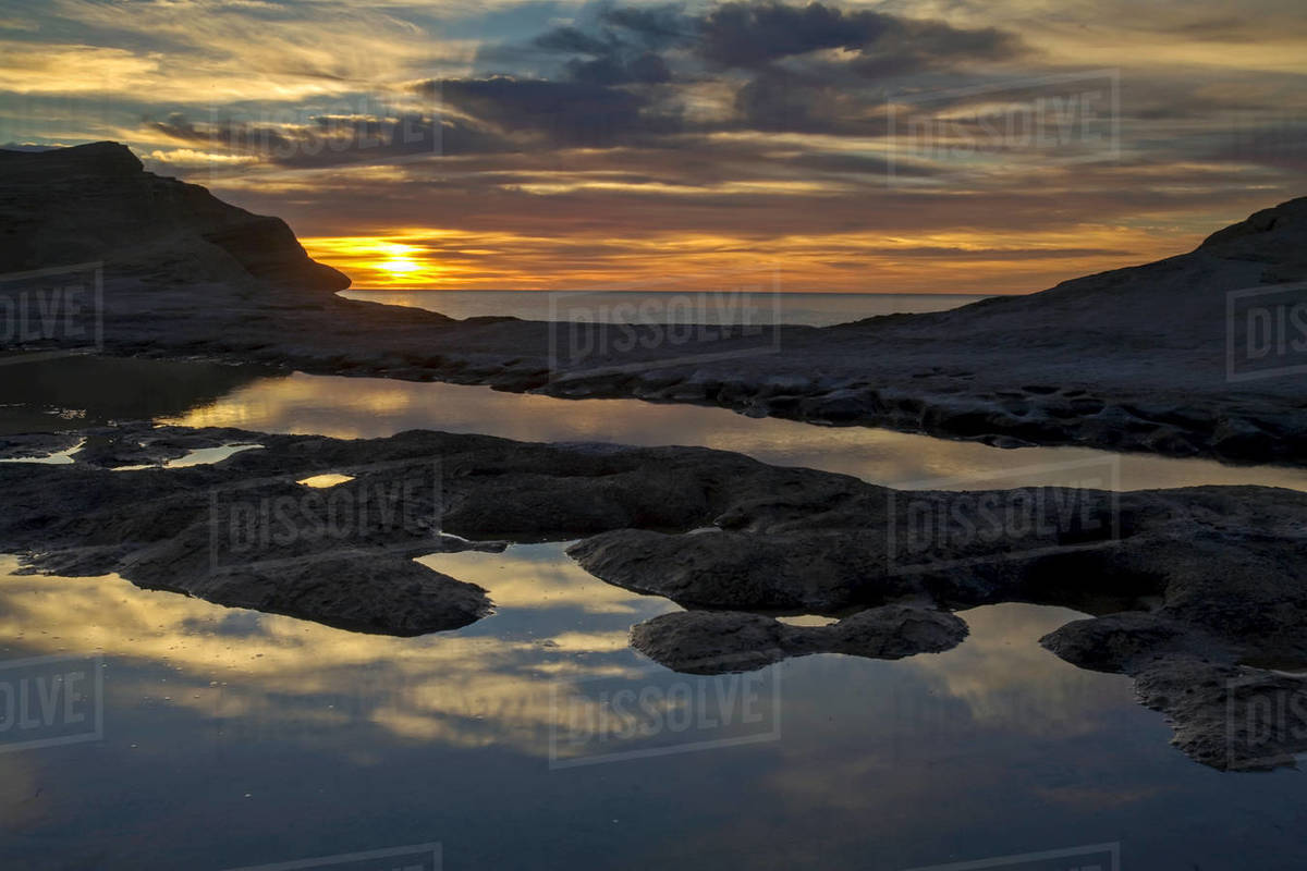 Tide pool reflection at sunrise, Baja California, Mexico. - Royalty ...