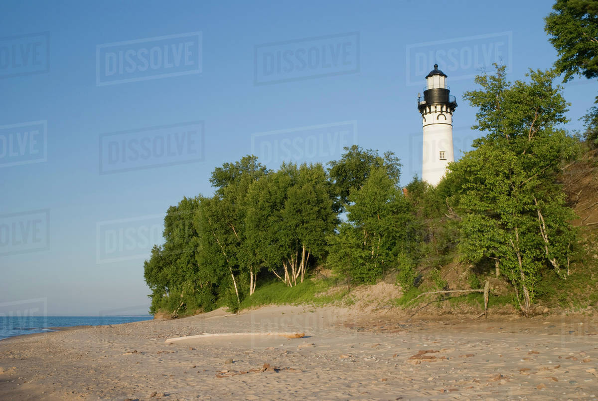 Lighthouse Viewed From A Sandy Beach; Michigan, United States of ...