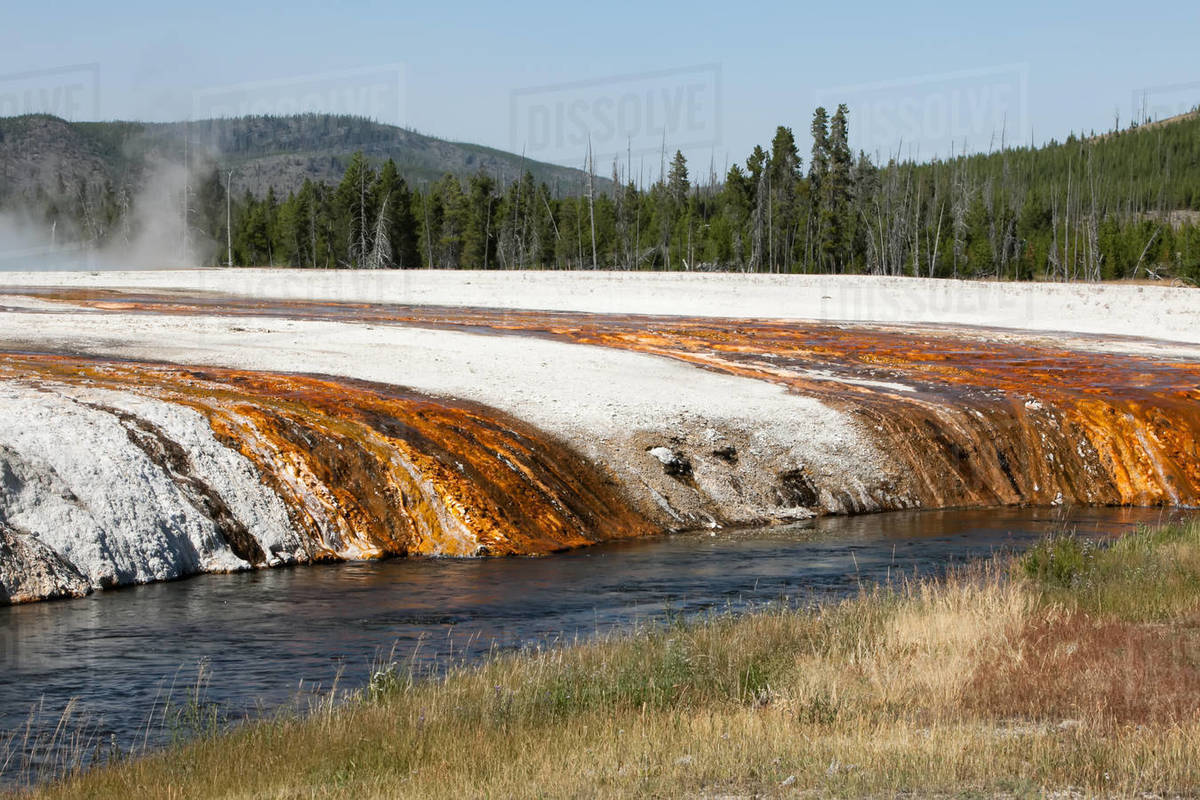 White and colorful mineral deposits from geothermal features near an ...