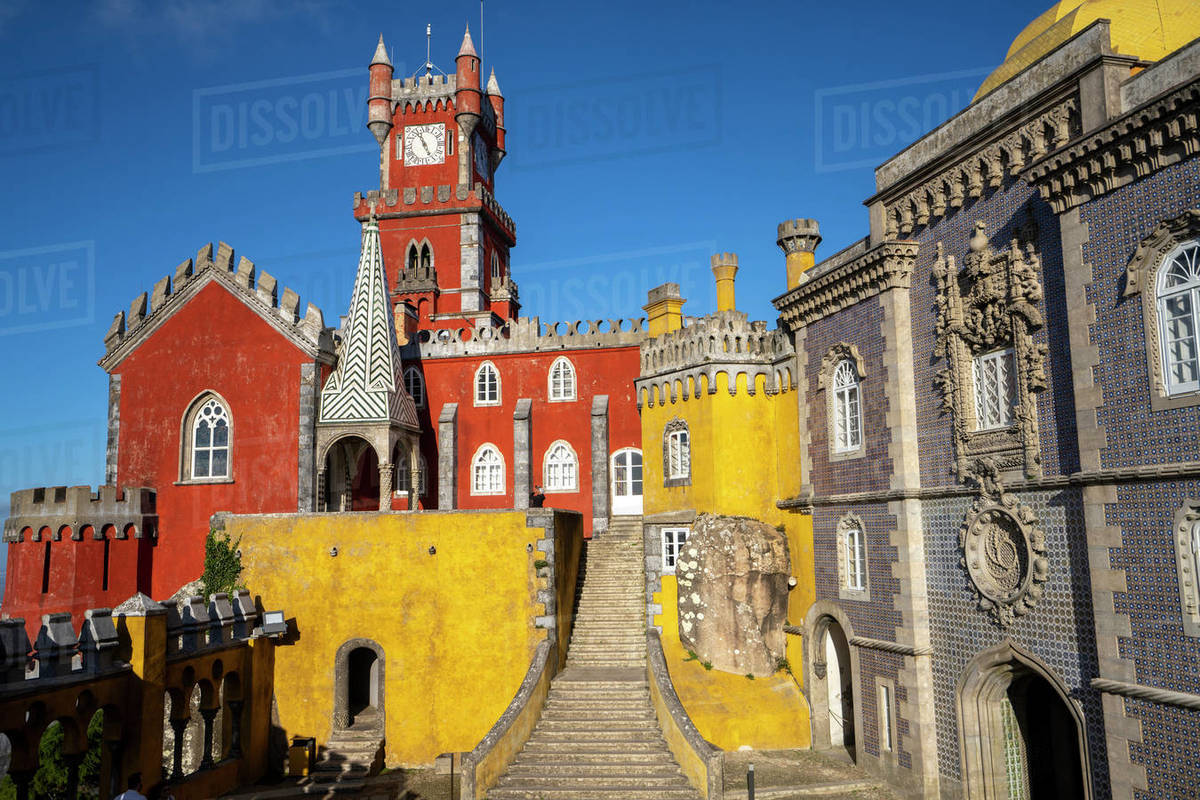 The hilltop castle of Palacio Da Pena with its colorful towers and ...