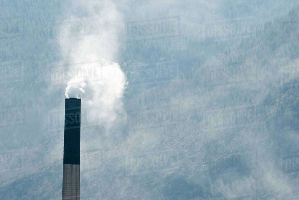 Steam Comes From A Smokestack At A Smelter In Bc - Royalty-free Stock ...