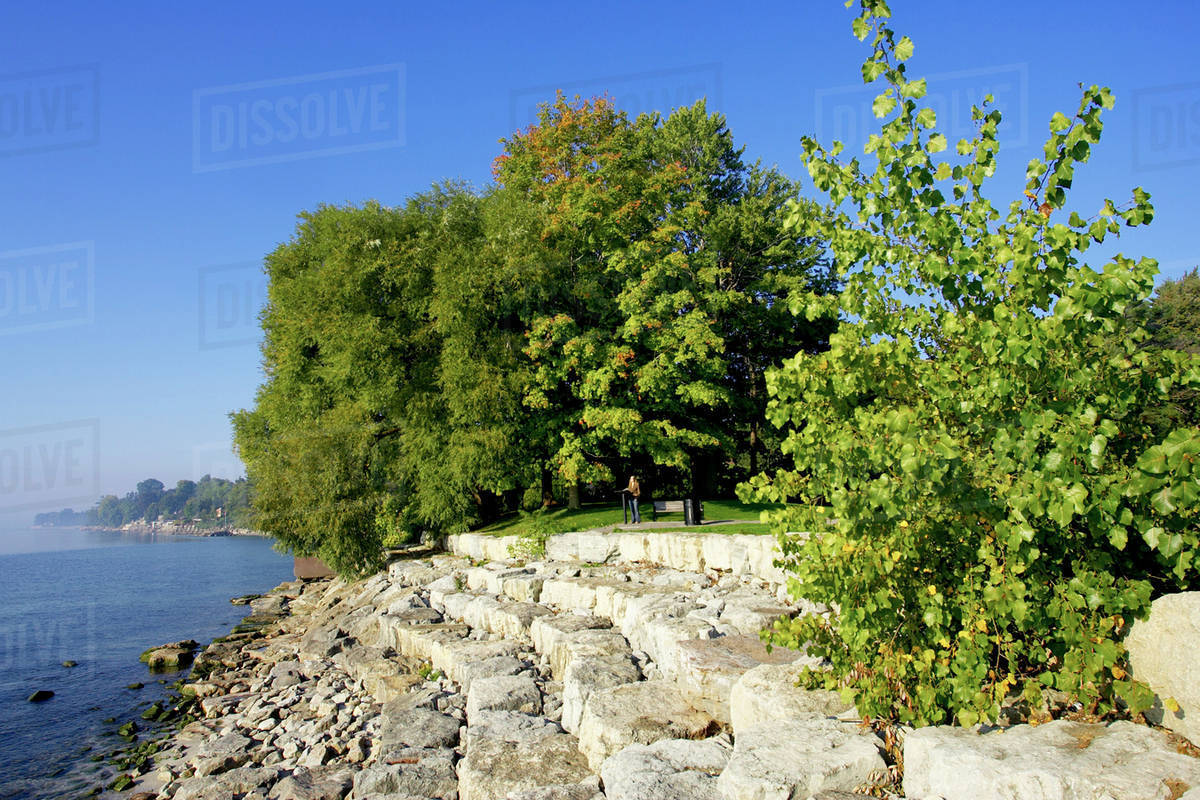 Person At Edge Of Tiered Rock Embankment Along Lake Ontario, Burlington ...