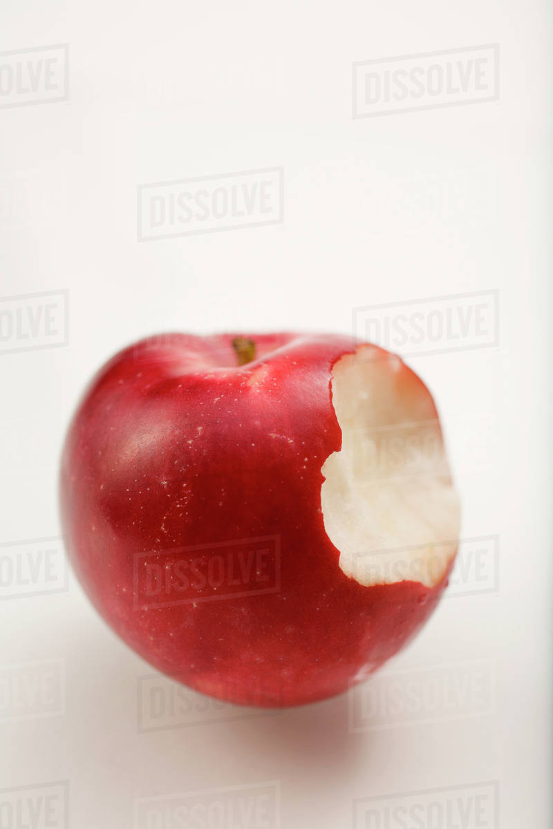 Organic Apple With Bite Taken Out - Royalty-free Stock Photo | Dissolve