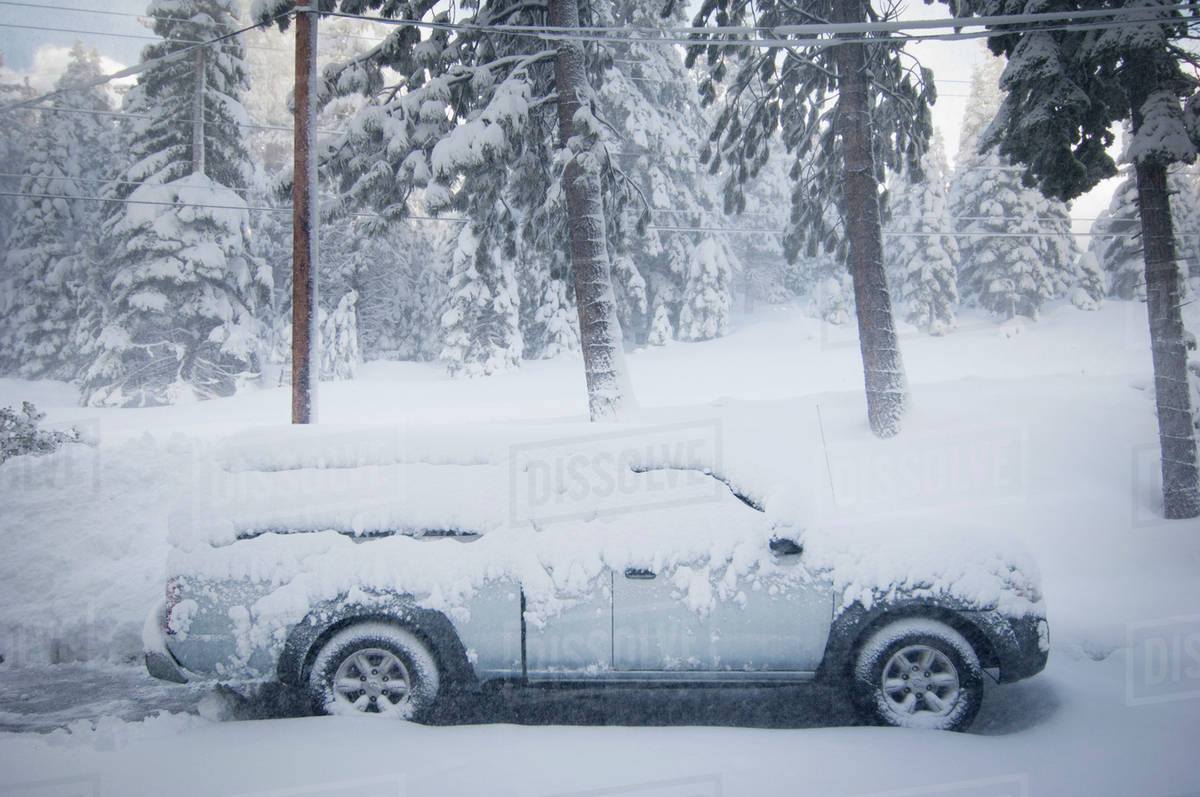 Small Truck Covered In Snow In A Driveway; South Lake Tahoe, California ...