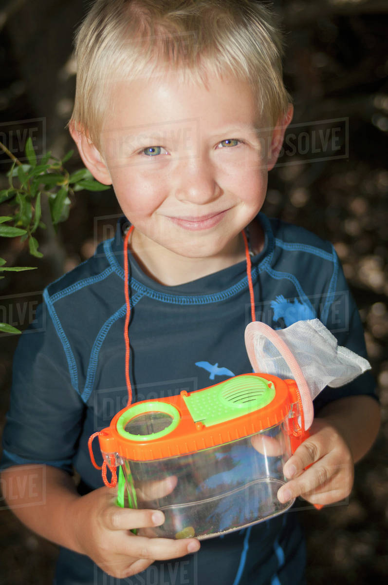 A Young Boy With A Bug Catcher; Lake Tahoe, California, United States ...